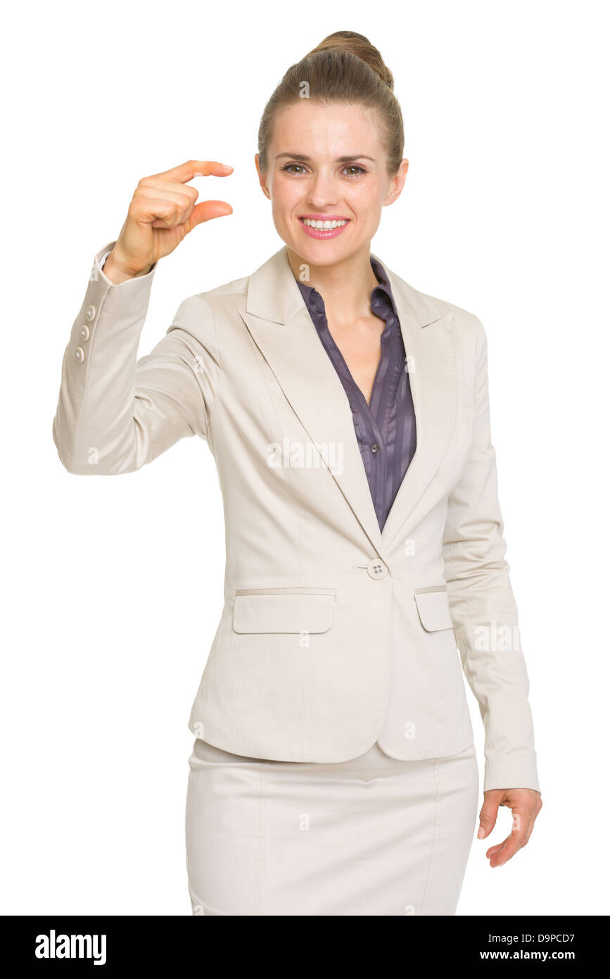 Business woman showing small risk gesture Stock Photo - Alamy