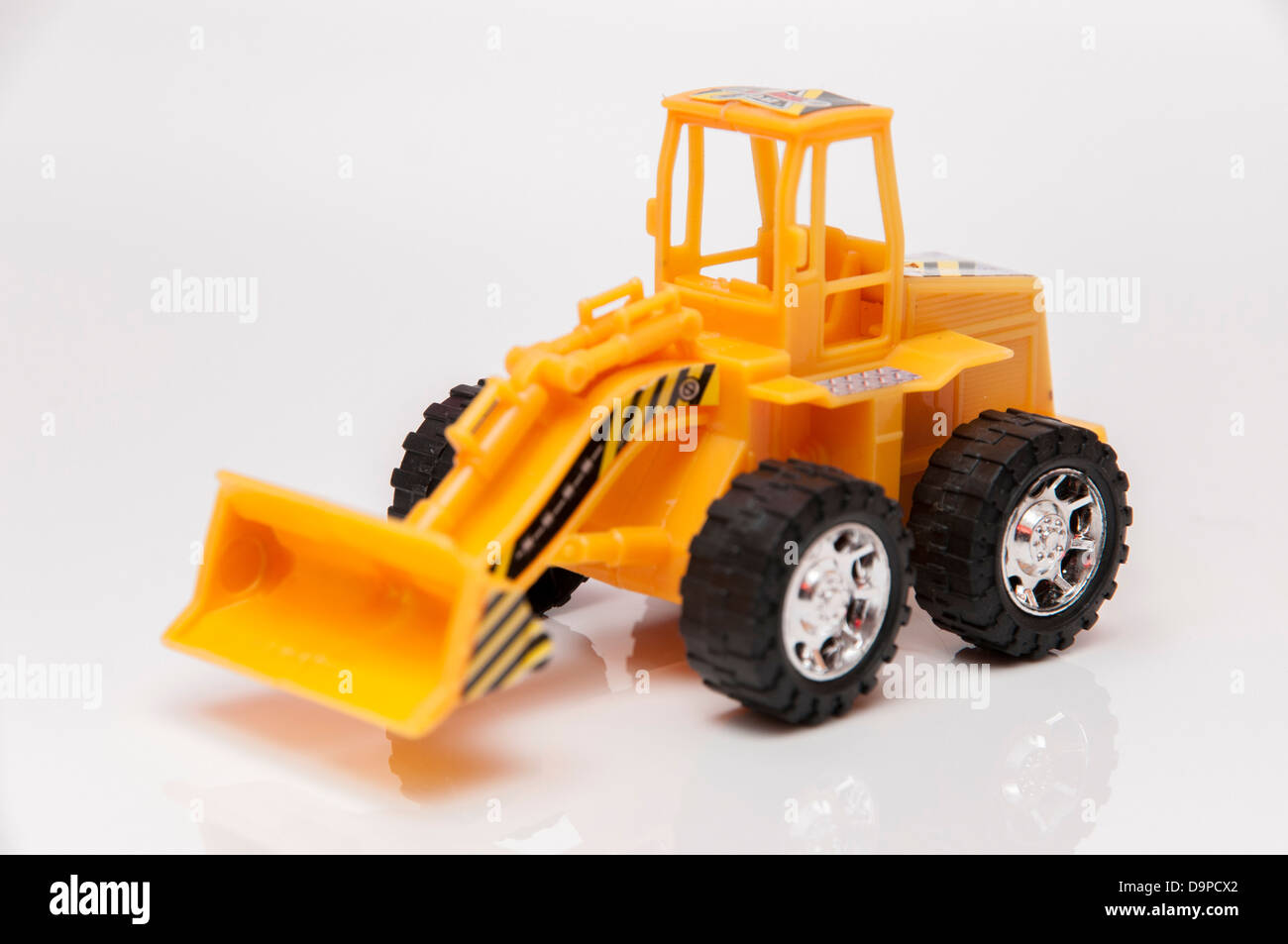 tractor yellow building to work in construction Stock Photo - Alamy