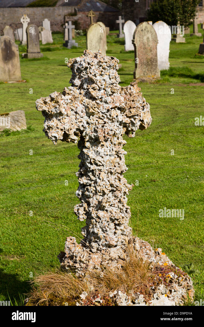 Heavily eroded grave marker cross in Saint Aidans church, Bamburgh ...