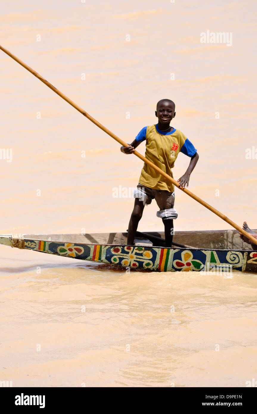 Boy in a pinnase on the Niger river. Mopti, Mali Stock Photo - Alamy