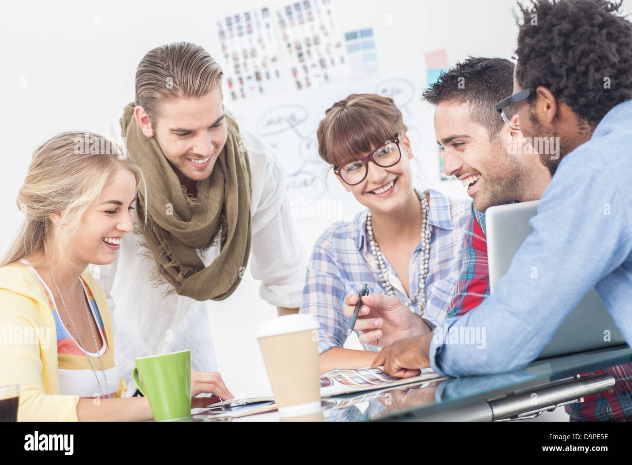 Happy team of creative designers working together Stock Photo - Alamy