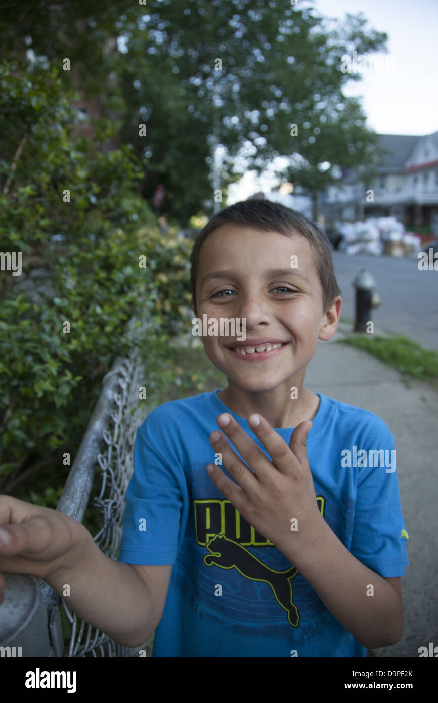 Smiling bright eyed boy on the street, Brooklyn, NY Stock Photo - Alamy