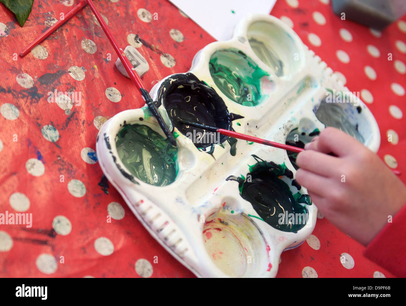 A palette of paints in a UK primary school in close up Stock Photo - Alamy