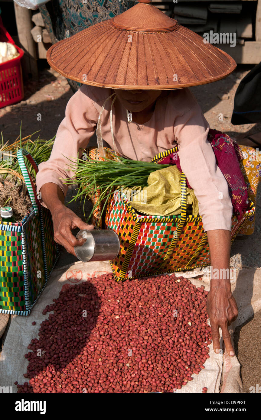 Traditional Shan states bamboo hat worn by female market shopper Inle ...
