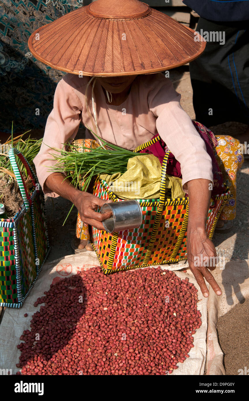 Traditional Shan states bamboo hat worn by female market shopper Inle ...