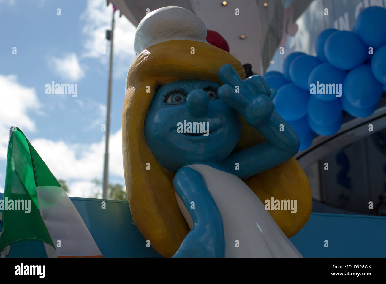 A figurine of Smurfette on top of a promotional car Stock Photo - Alamy
