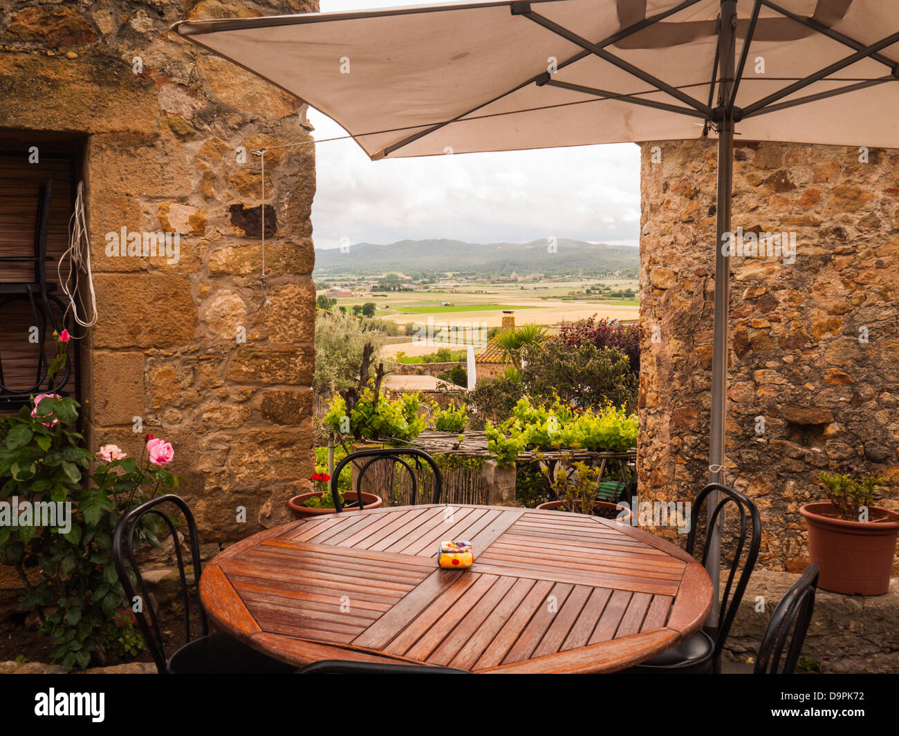 View from restaurant table between traditional stone houses, Pals ...