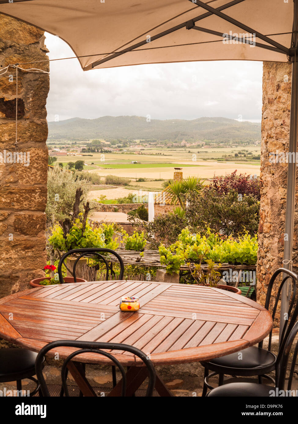 View from restaurant table between traditional stone houses, Pals ...