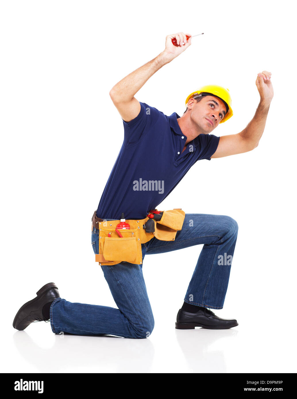 handsome handyman working over white background Stock Photo - Alamy