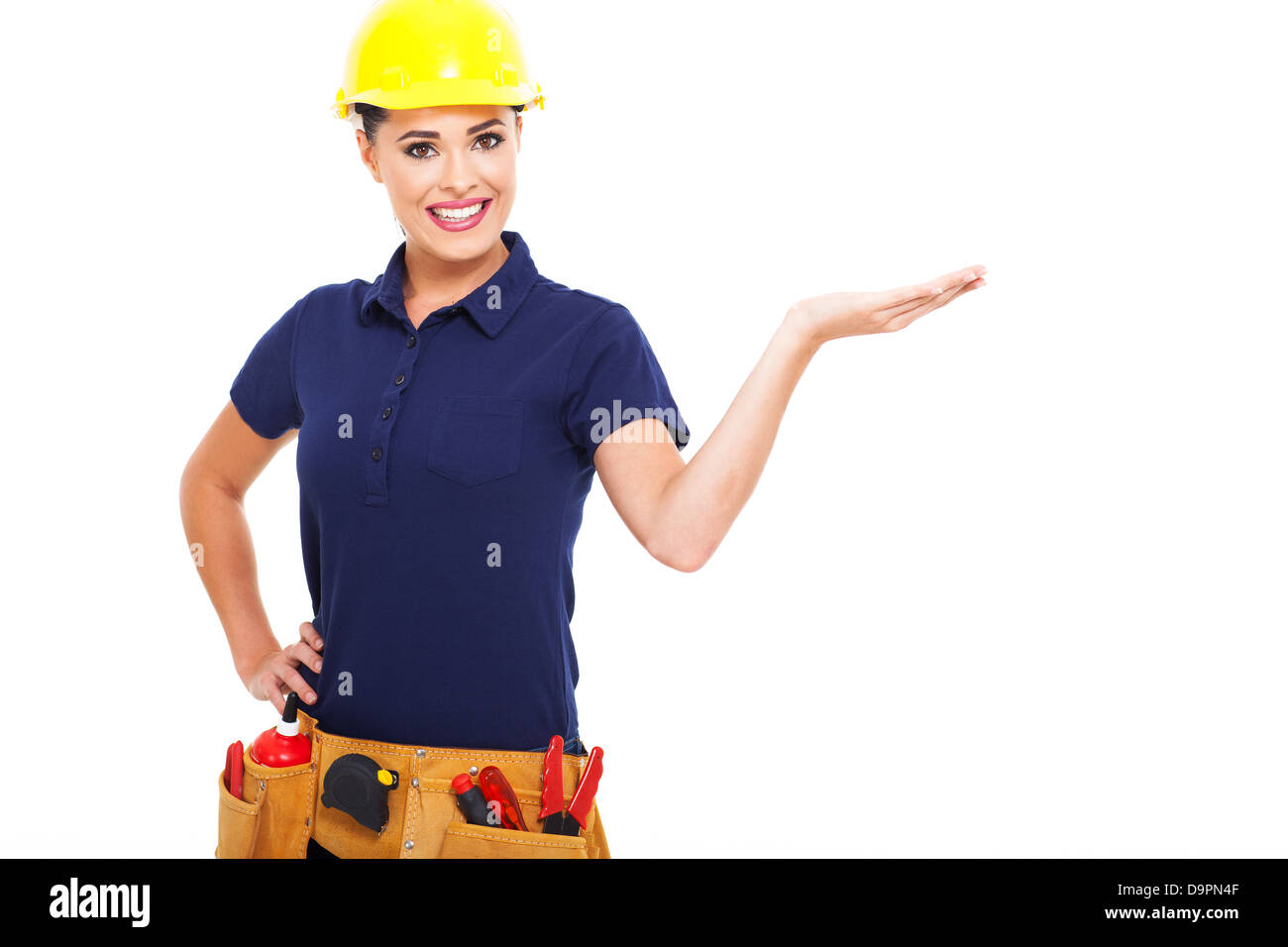attractive female builder presenting on white background Stock Photo ...