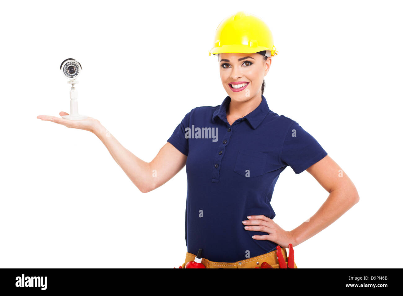 pretty female cctv installer presenting camera on white background ...