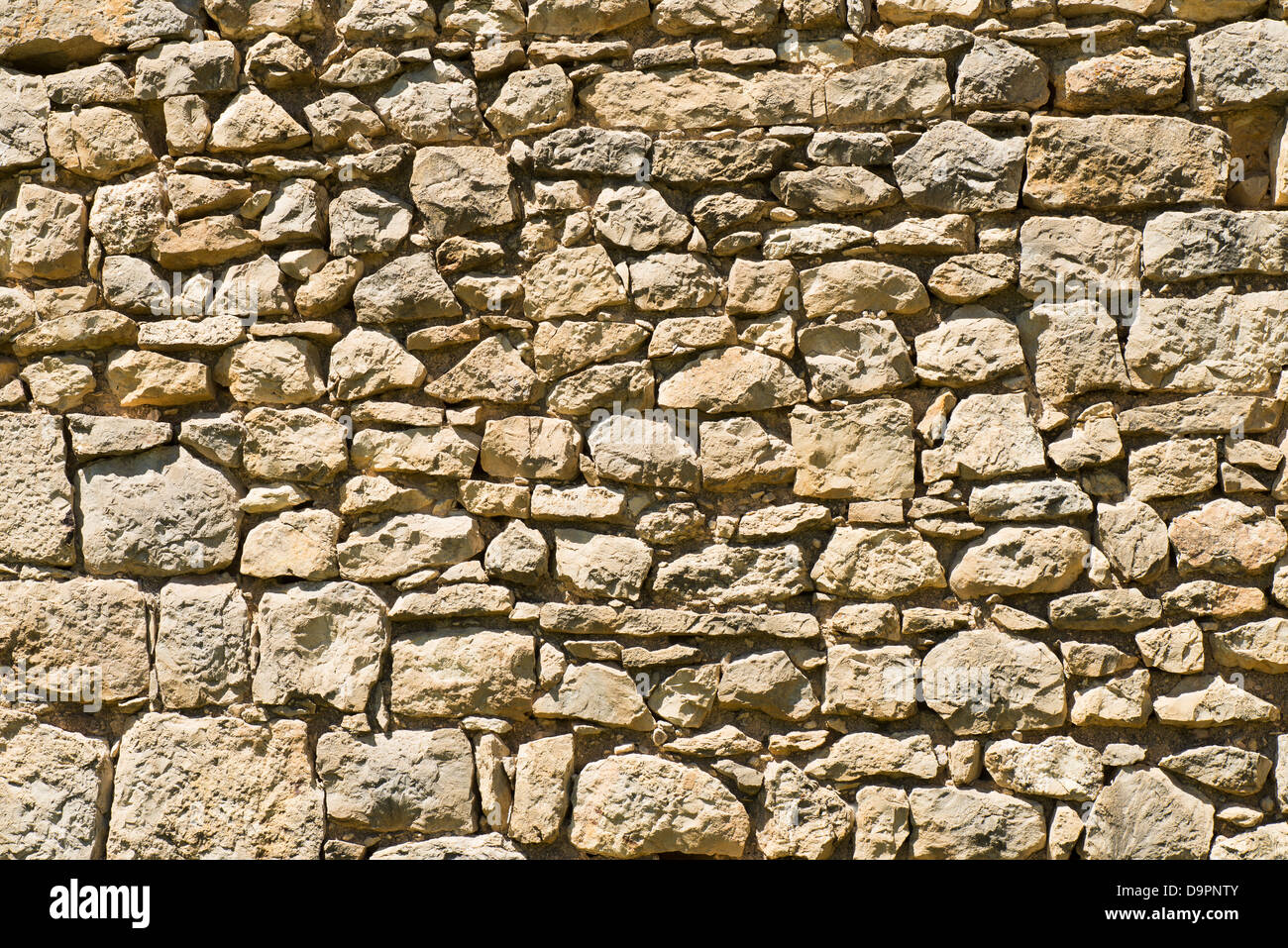 Old stone wall with an irregular pattern Stock Photo - Alamy