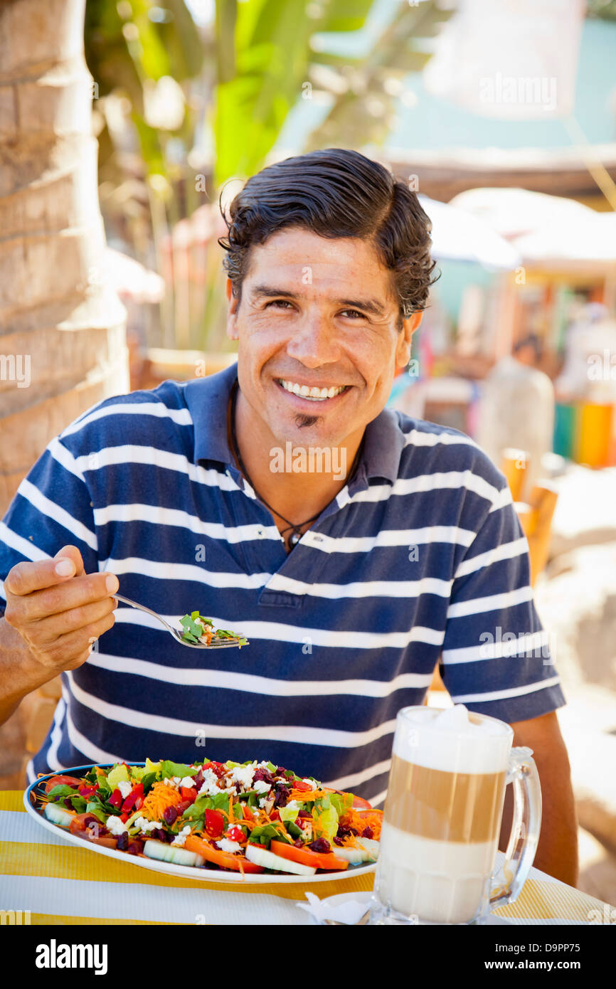 Man eating at outdoor caf Stock Photo - Alamy