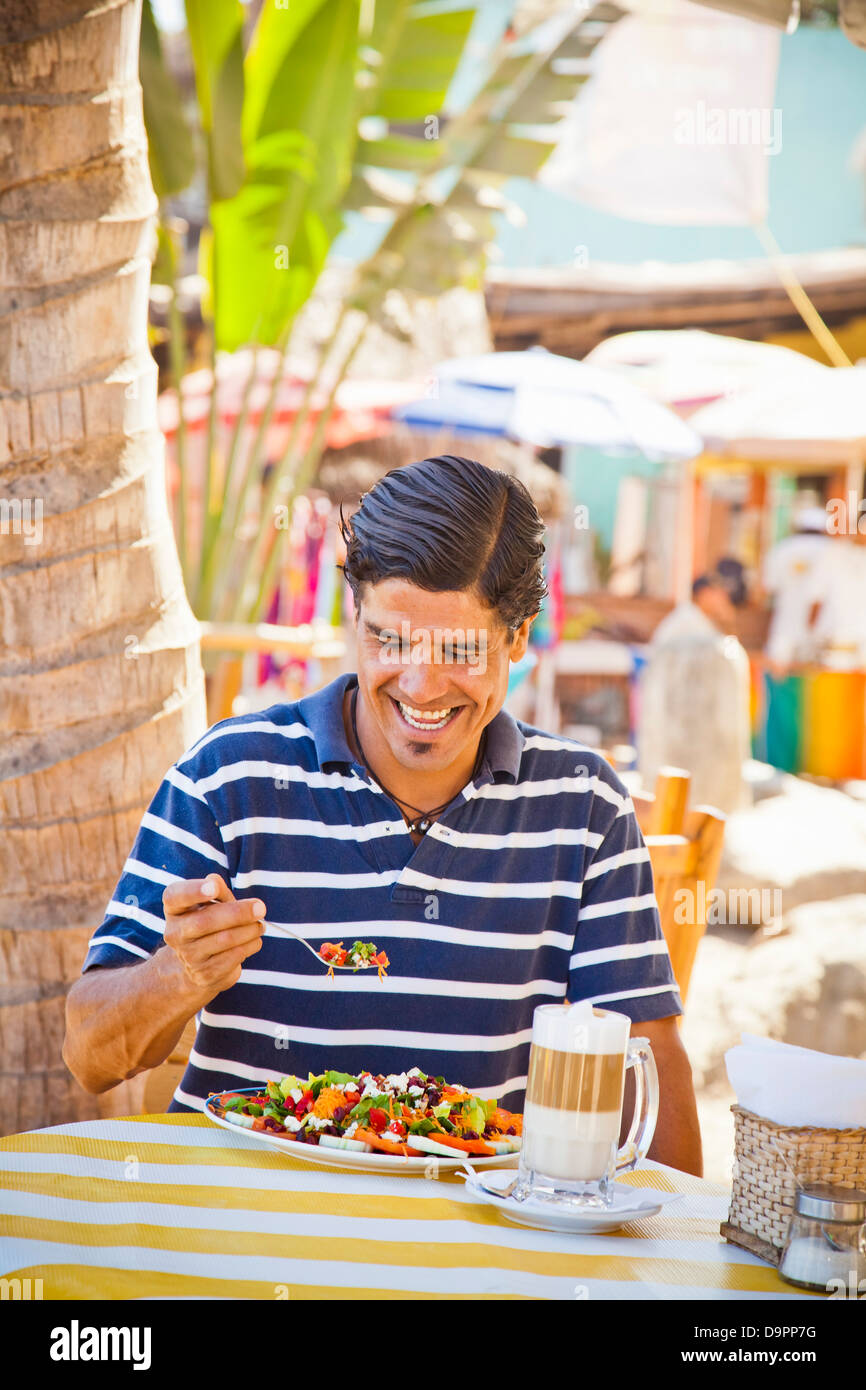 Man eating at outdoor caf Stock Photo - Alamy