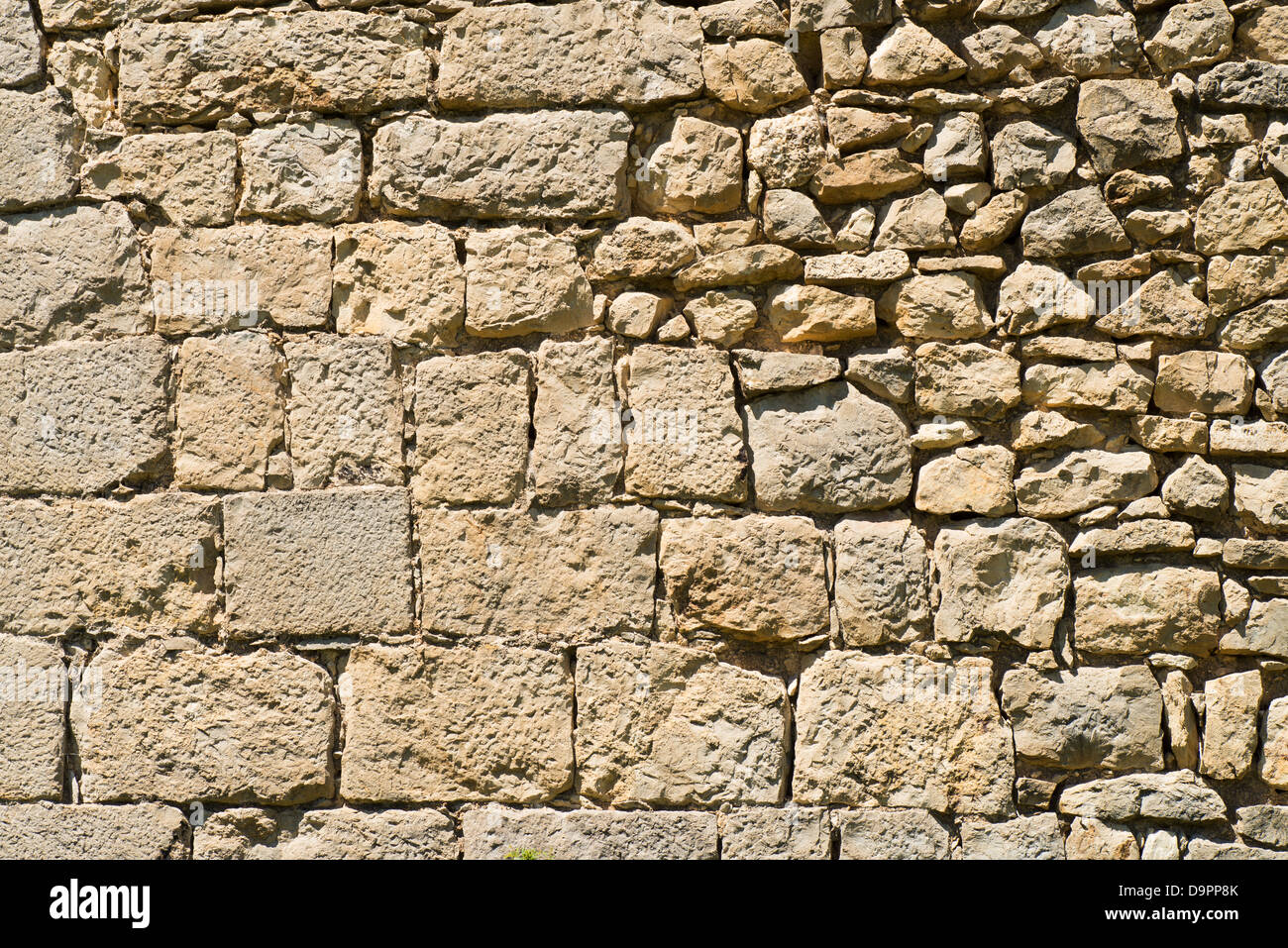 Weathered masonry wall with irregular stone sizes Stock Photo - Alamy