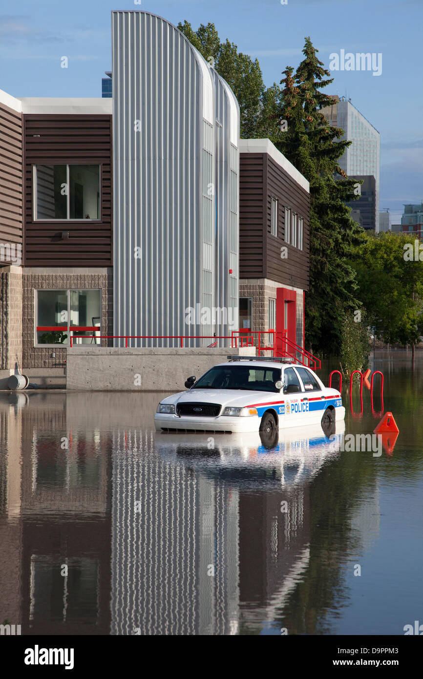 Saturday, June 22, 2013. A police car trapped in a parking lot by ...