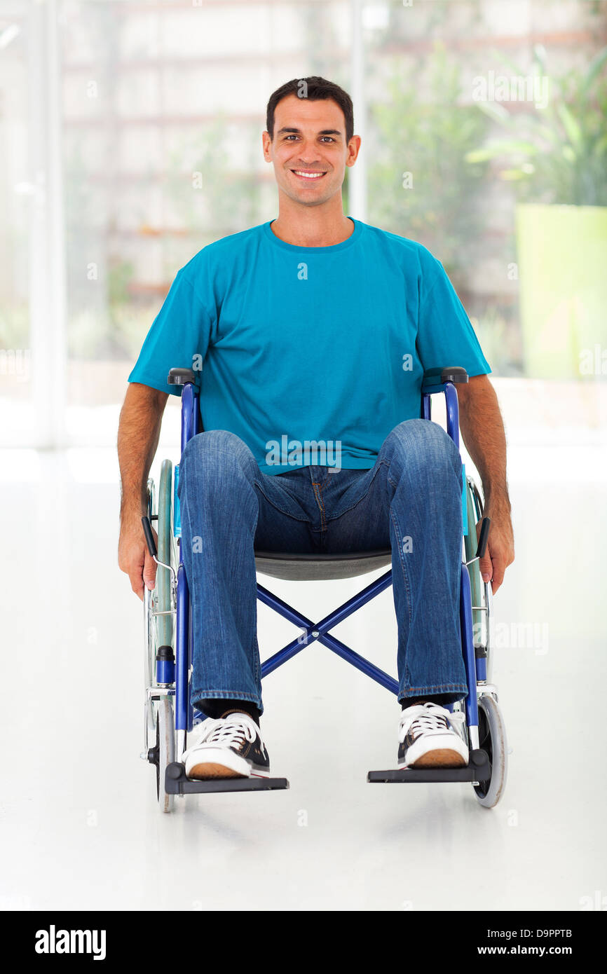 optimistic handicapped man sitting on wheelchair Stock Photo - Alamy