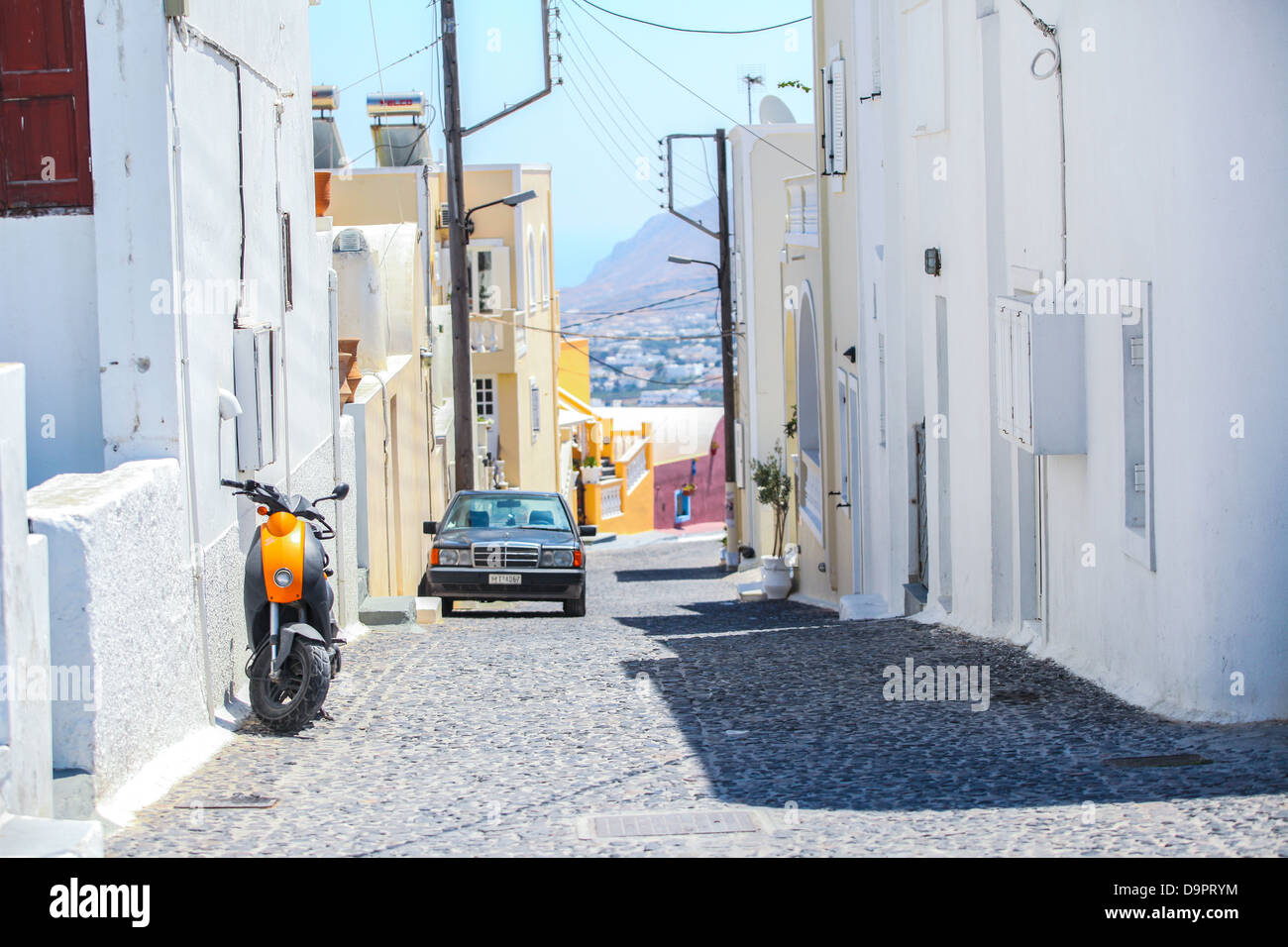 Typical cobbled street in greek village Santorini, Greece Stock Photo ...