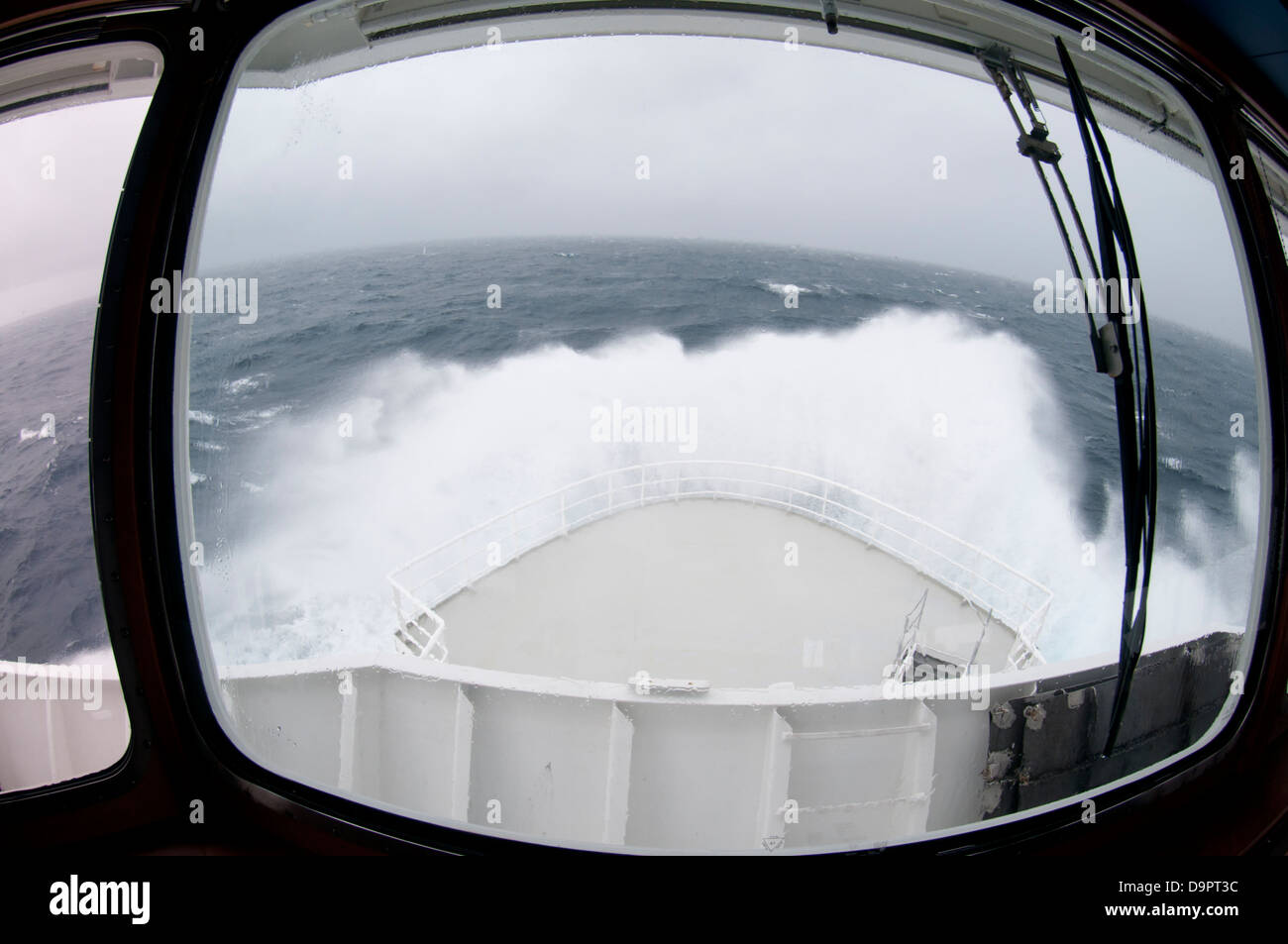 Stormy weather at sea. Vessel bow view with big waves and strong wind ...