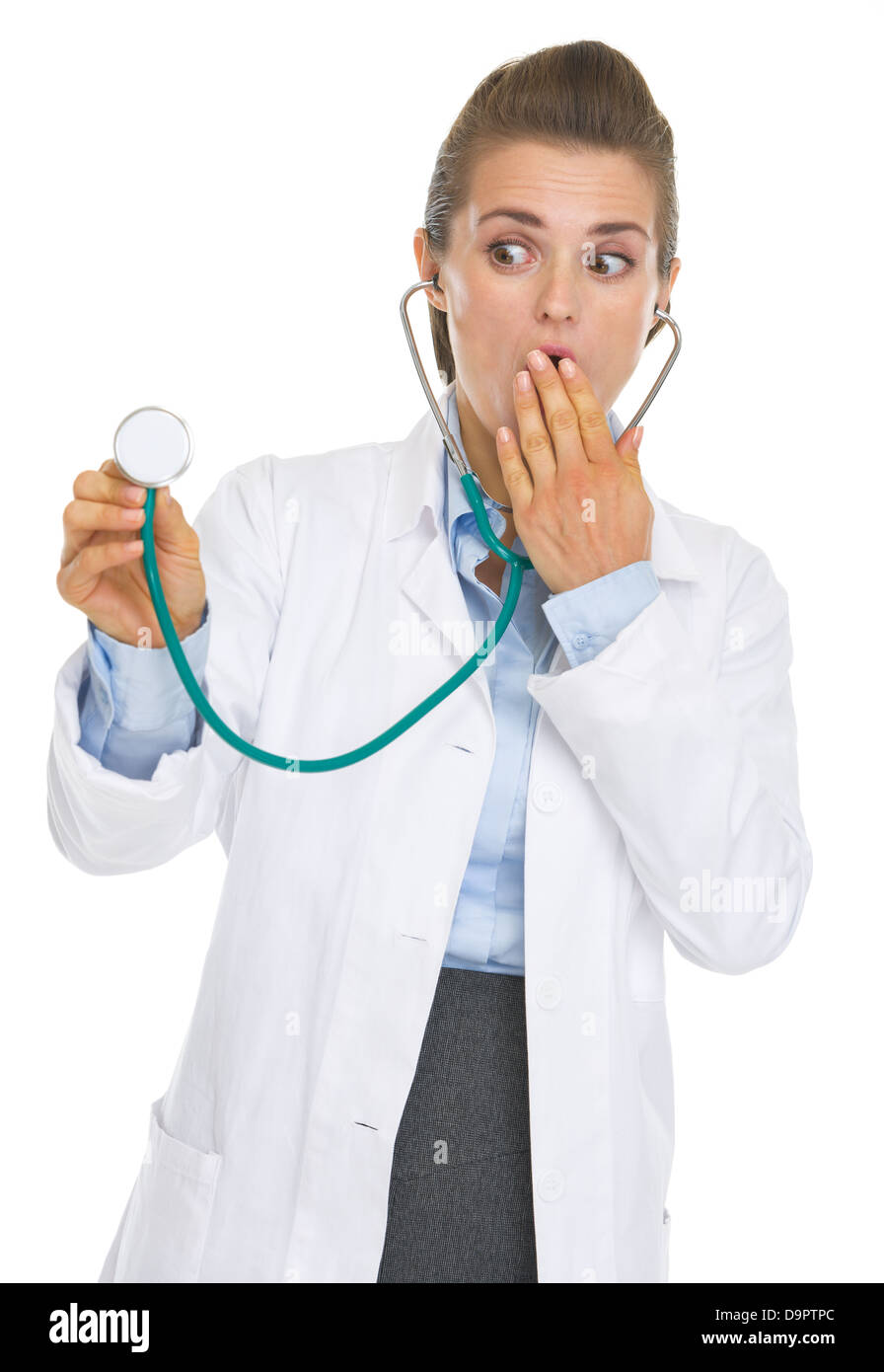 Surprised doctor woman using stethoscope Stock Photo - Alamy