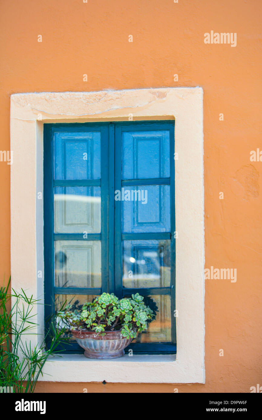 Traditional greek Style windows with flowerpot on him Stock Photo - Alamy