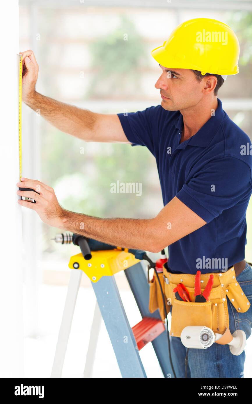 professional security surveillance system installer installing a cctv ...