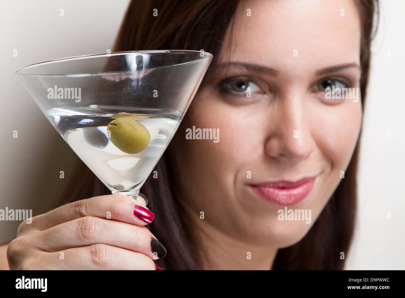 Pretty young woman drinking Stock Photo - Alamy