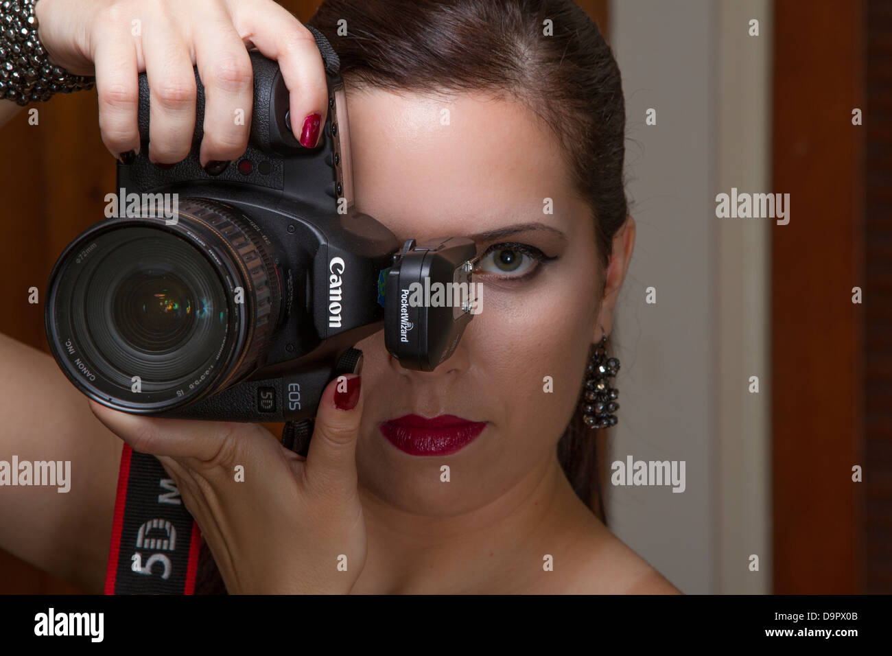A model holding a DSLR Stock Photo - Alamy