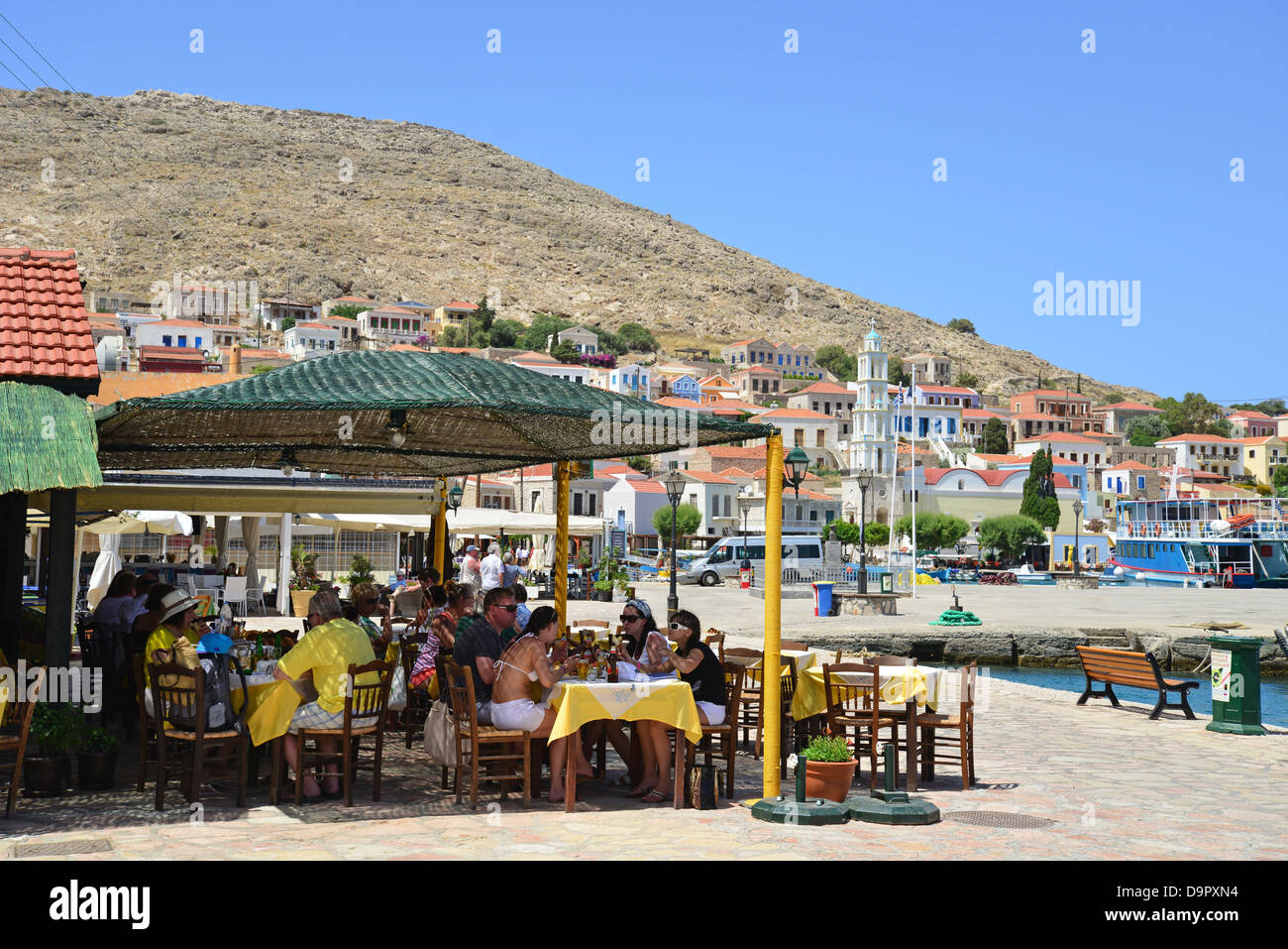 Waterfront taverna port emporio halki hi-res stock photography and ...