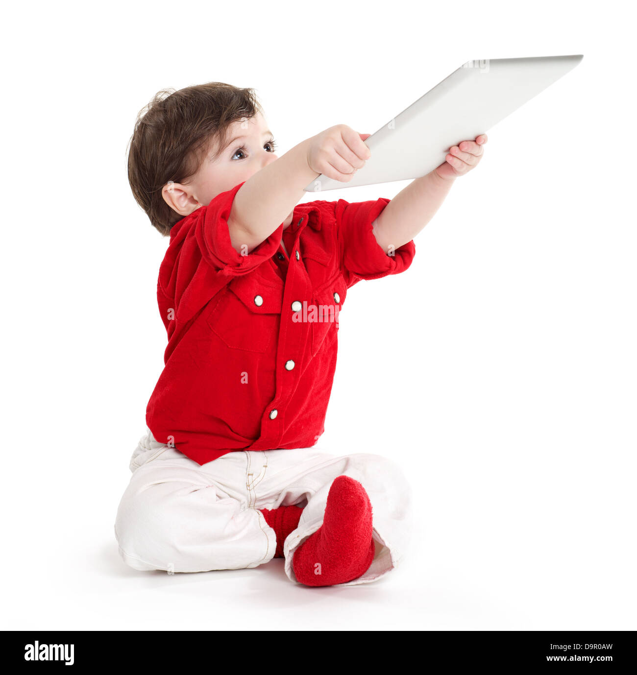 Toddler baby sitting and give tablet Stock Photo - Alamy
