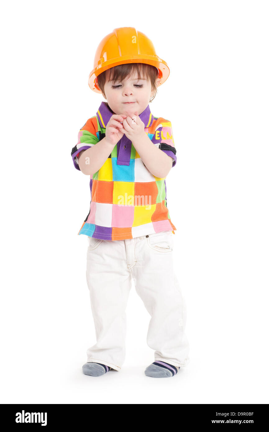Cute baby kid with construction helmet and having fun Stock Photo - Alamy