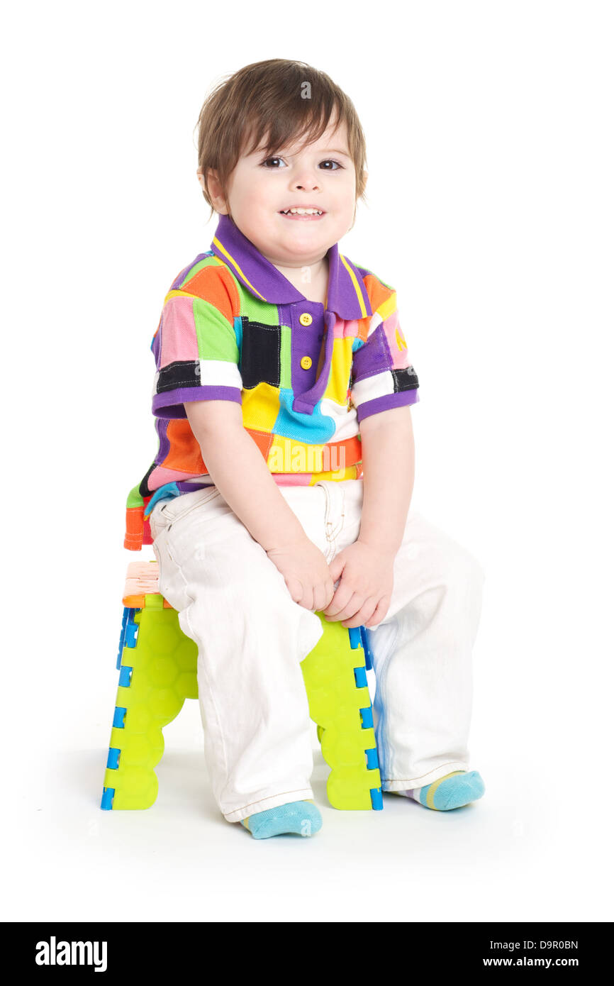 Boy sitting on white Cut Out Stock Images & Pictures - Alamy