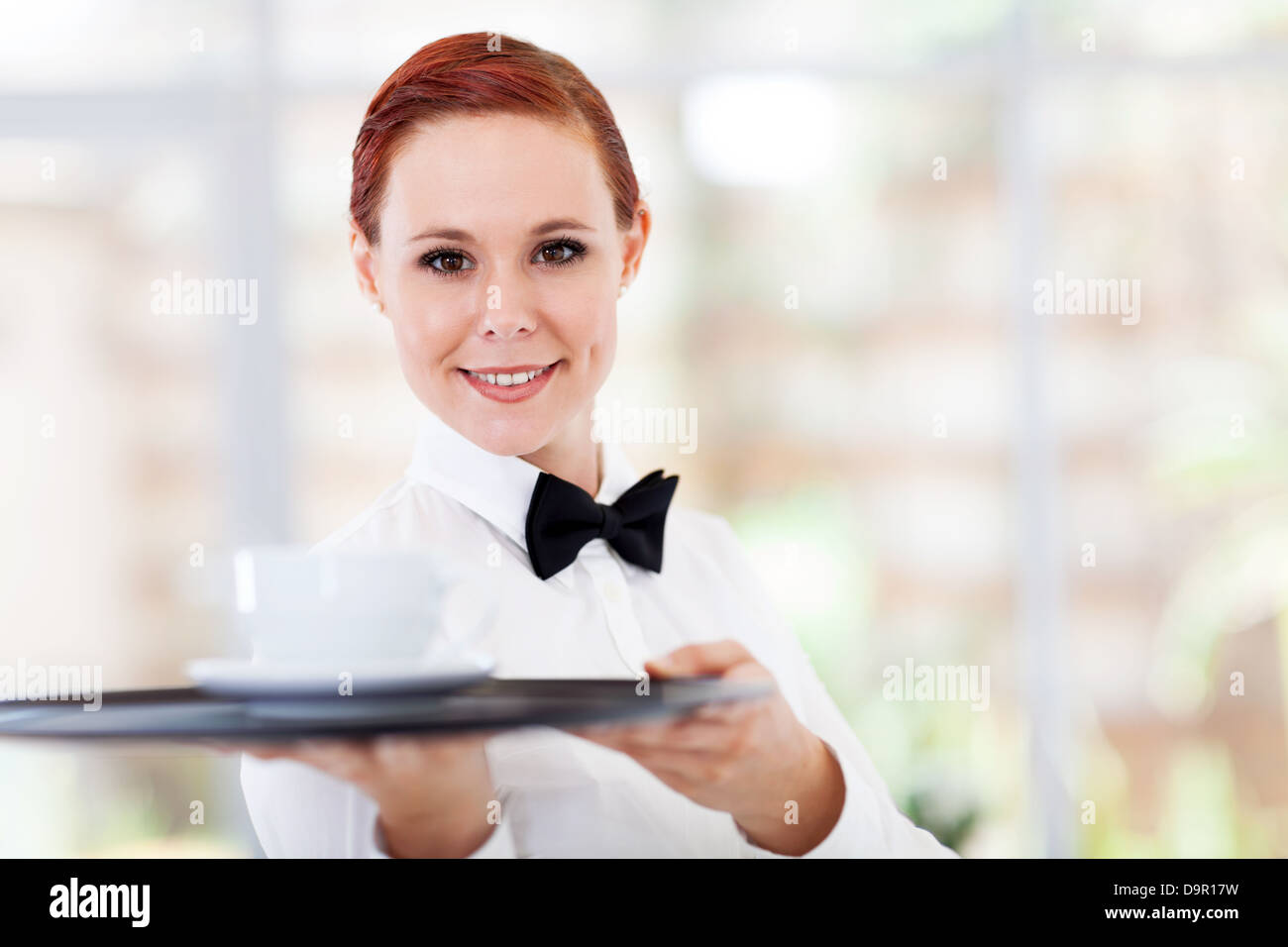 attractive young waitress serving coffee in cafe Stock Photo - Alamy