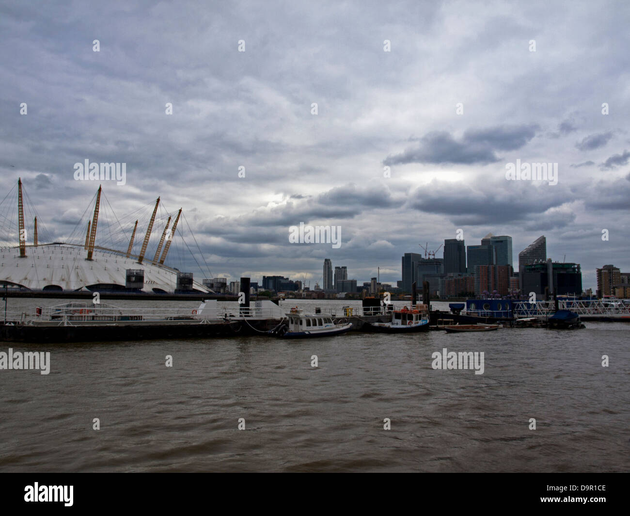 View across the River Thames showing the 02 Arena and Canary Wharf in ...