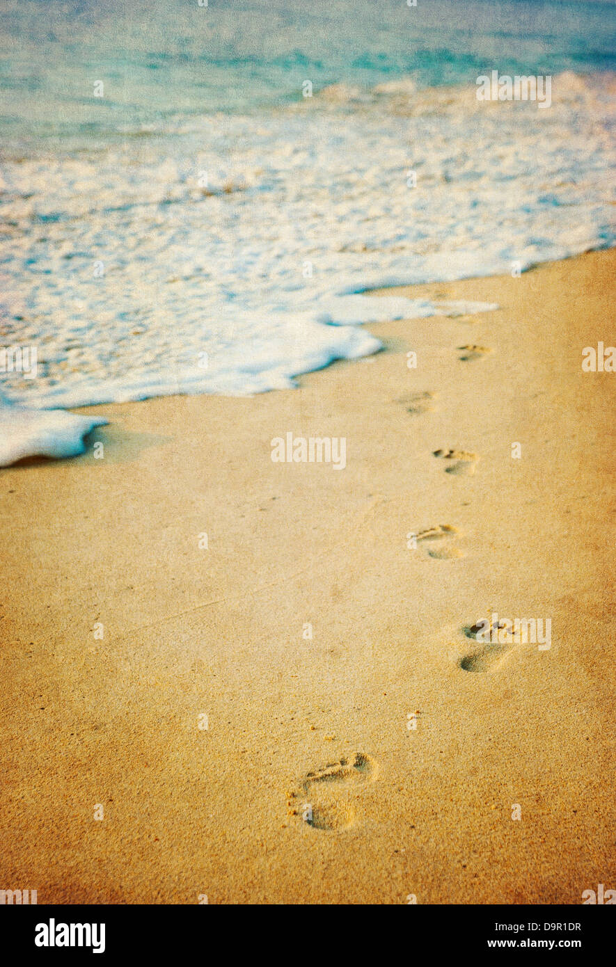 grunge image of footprints in a tropical beach Stock Photo - Alamy