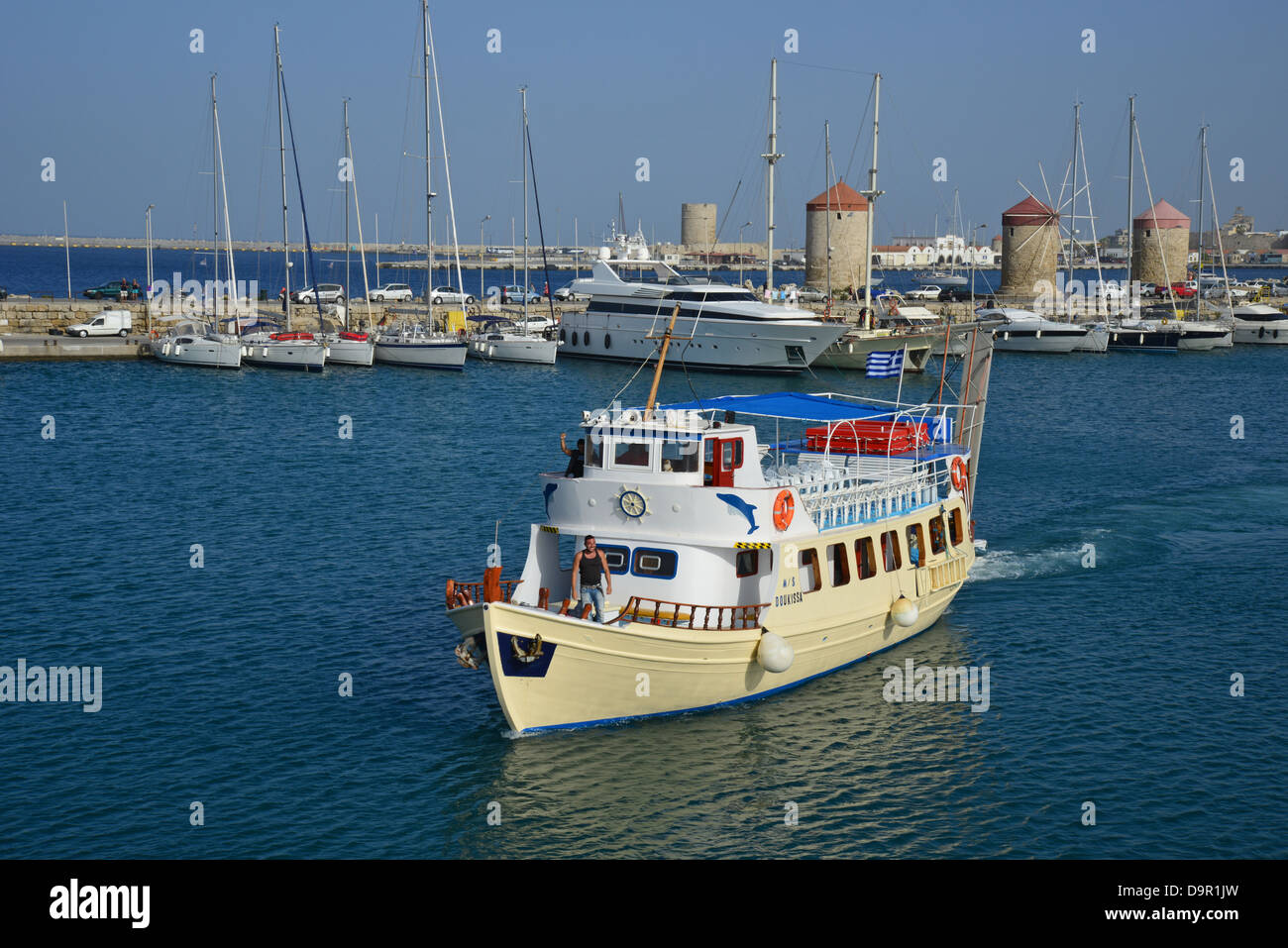 Ferry boat leaving Mandraki Harbour, City of Rhodes, Rhodes (Rodos ...