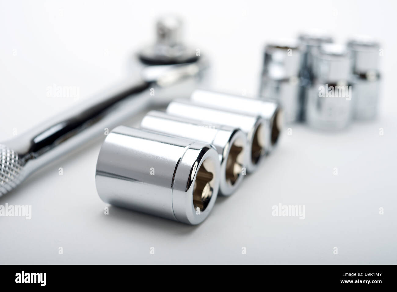 metal ratchet with sockets set on white background Stock Photo - Alamy