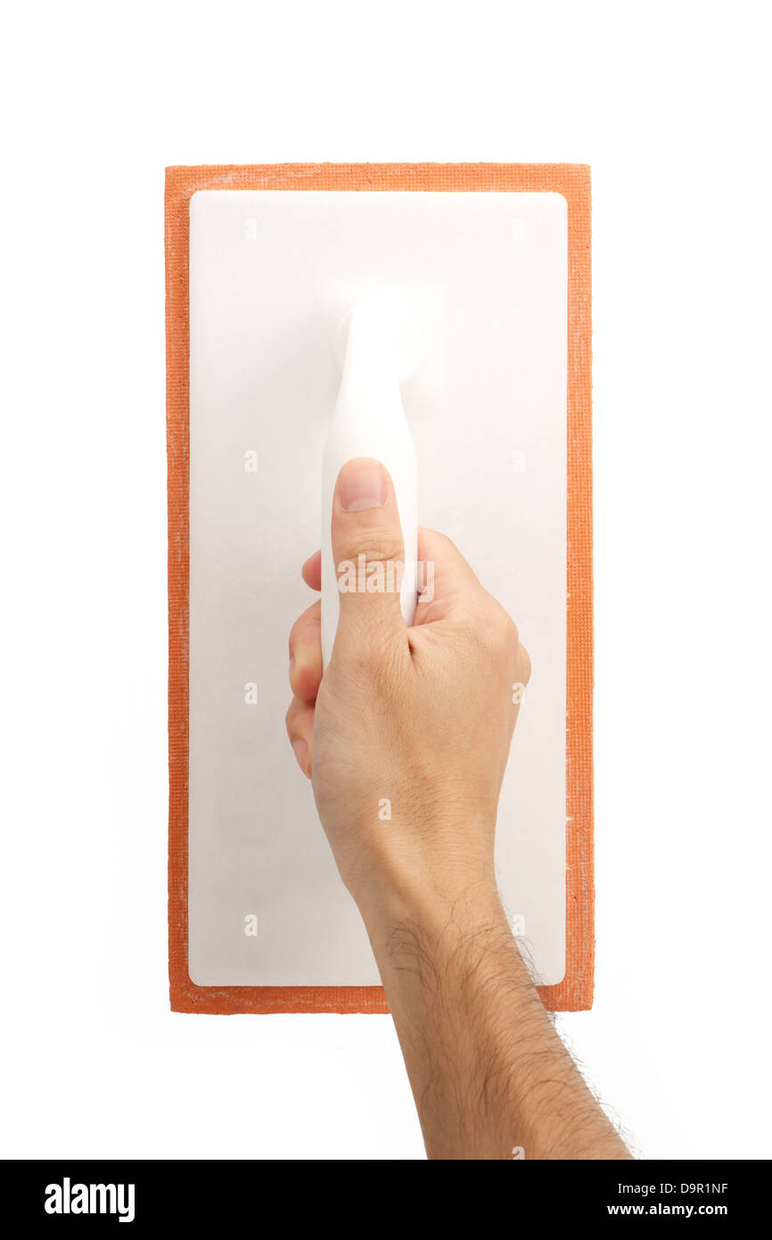 Hand holding plastic trowel on white background Stock Photo - Alamy