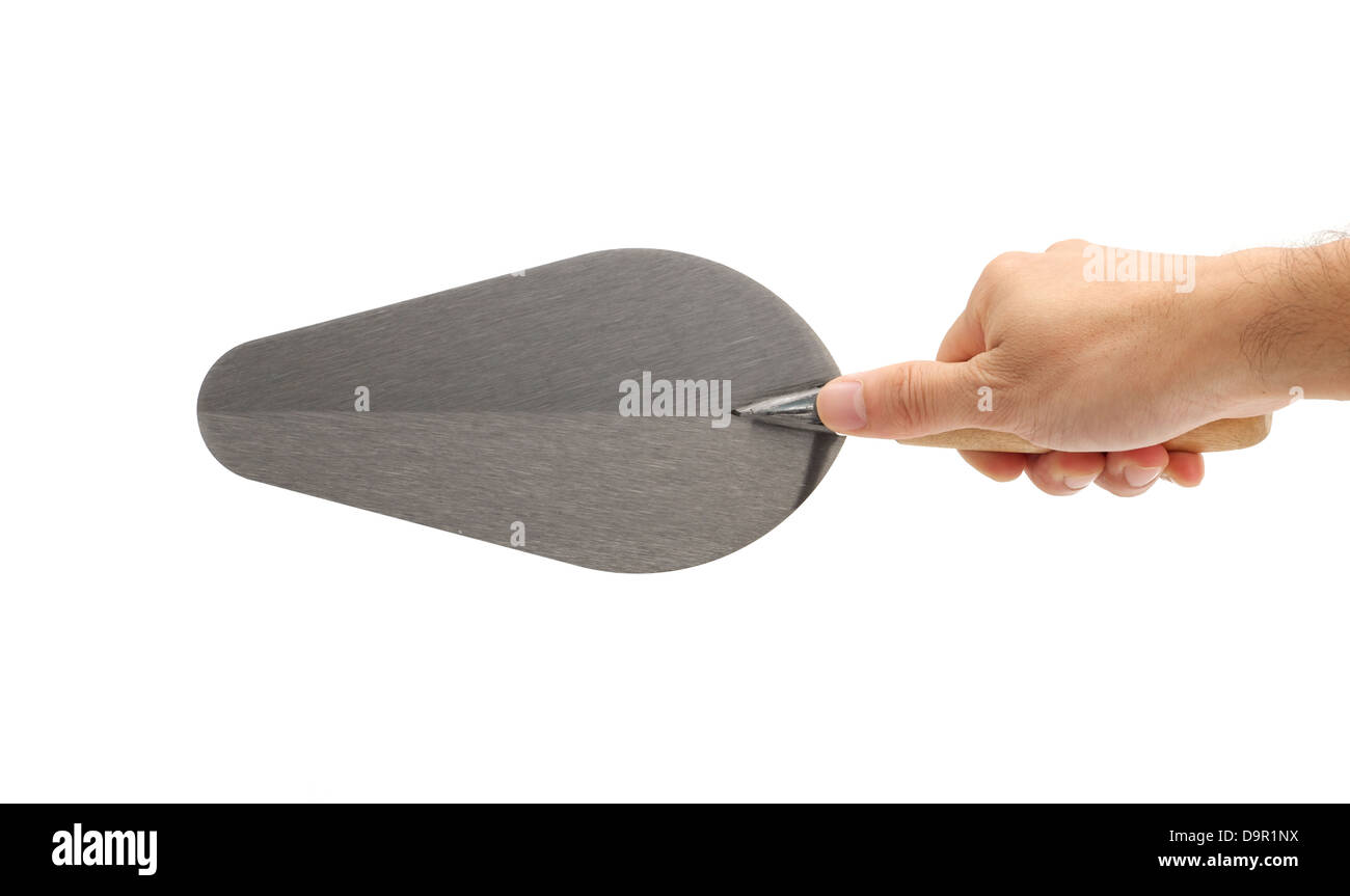 Hand holding trowel on white background Stock Photo - Alamy