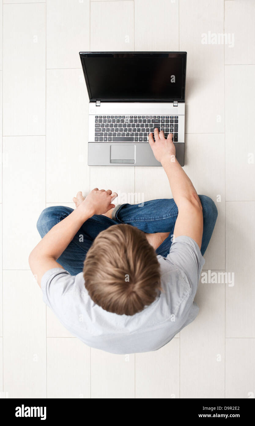 Man working on the laptop at home Stock Photo - Alamy