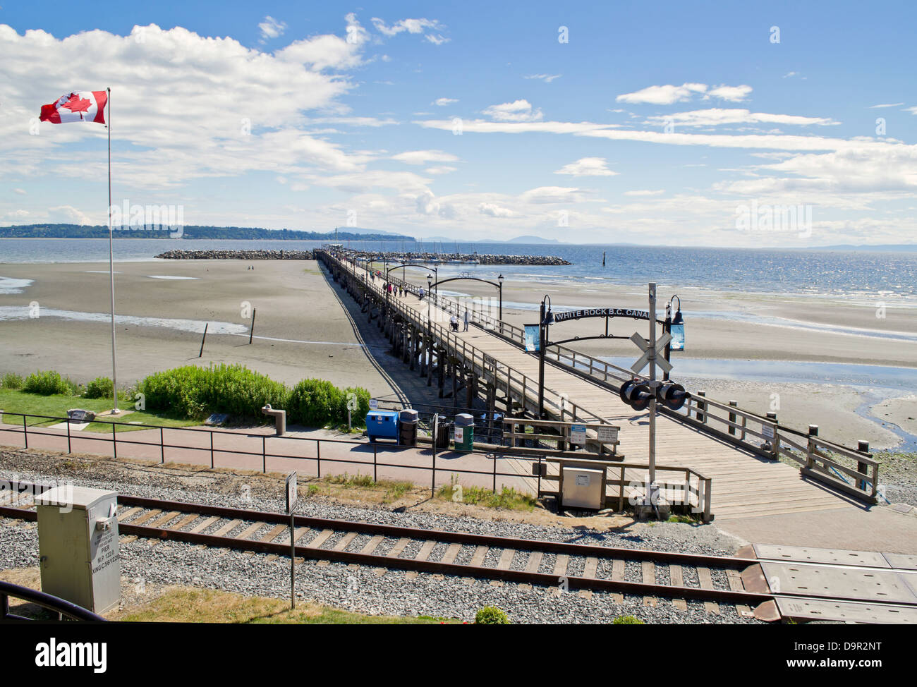 View of the pier into Boundary Bay in town of White Rock, British ...