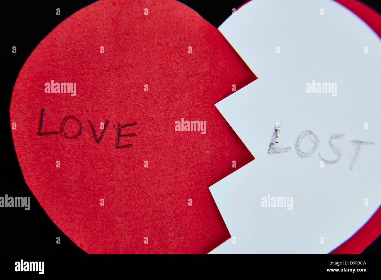 Broken heart with text "Love and Lost" written on it Stock Photo - Alamy