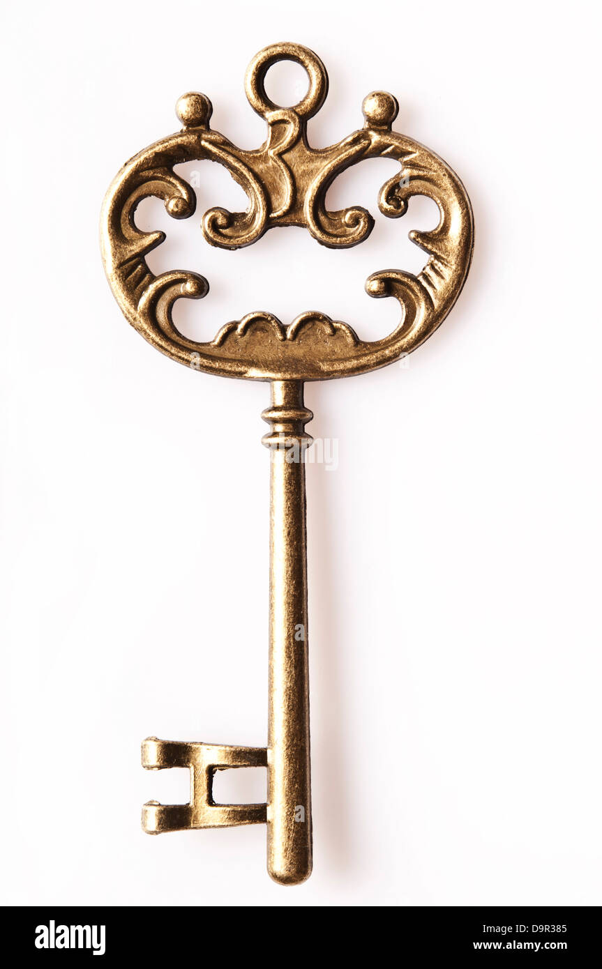 ornate antique golden skeleton key, isolated Stock Photo - Alamy