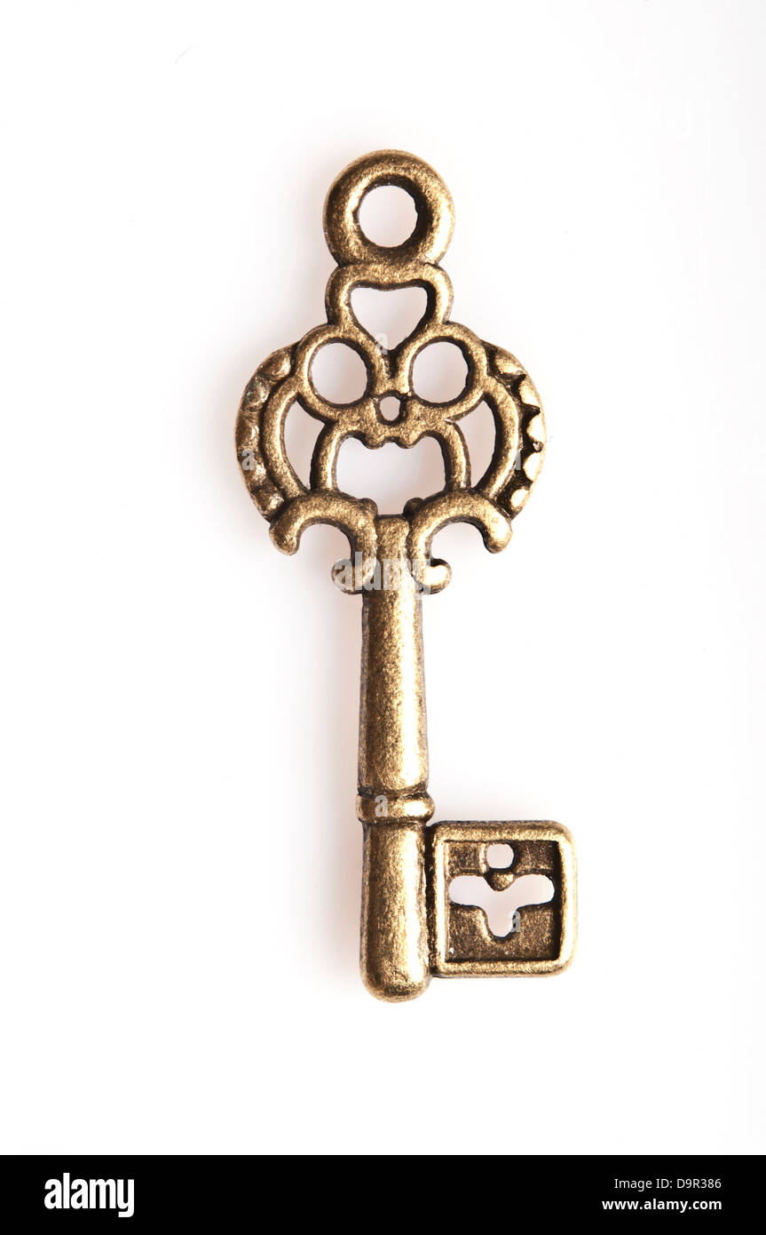 ornate antique golden skeleton key, isolated Stock Photo - Alamy