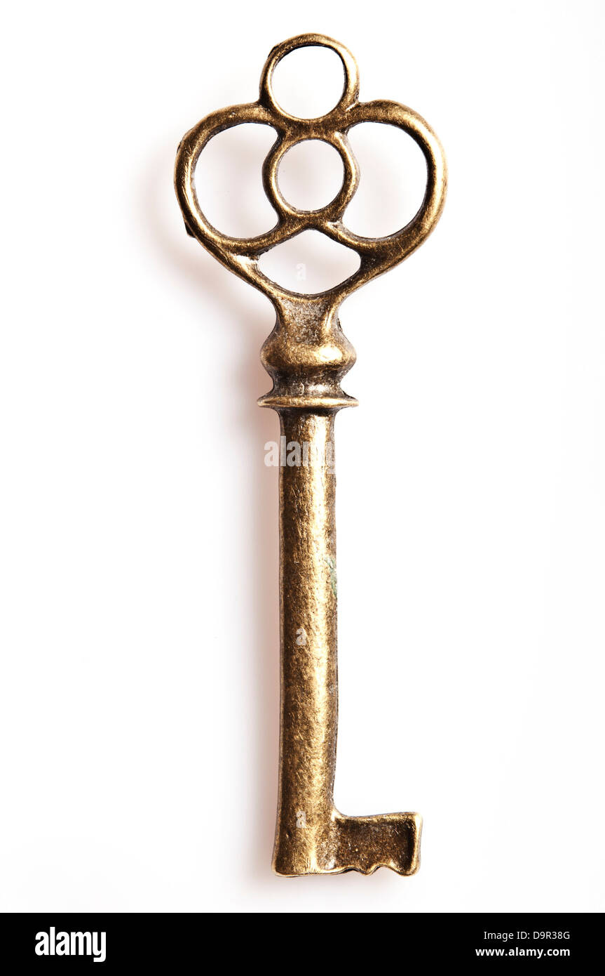 ornate antique golden skeleton key, isolated Stock Photo - Alamy