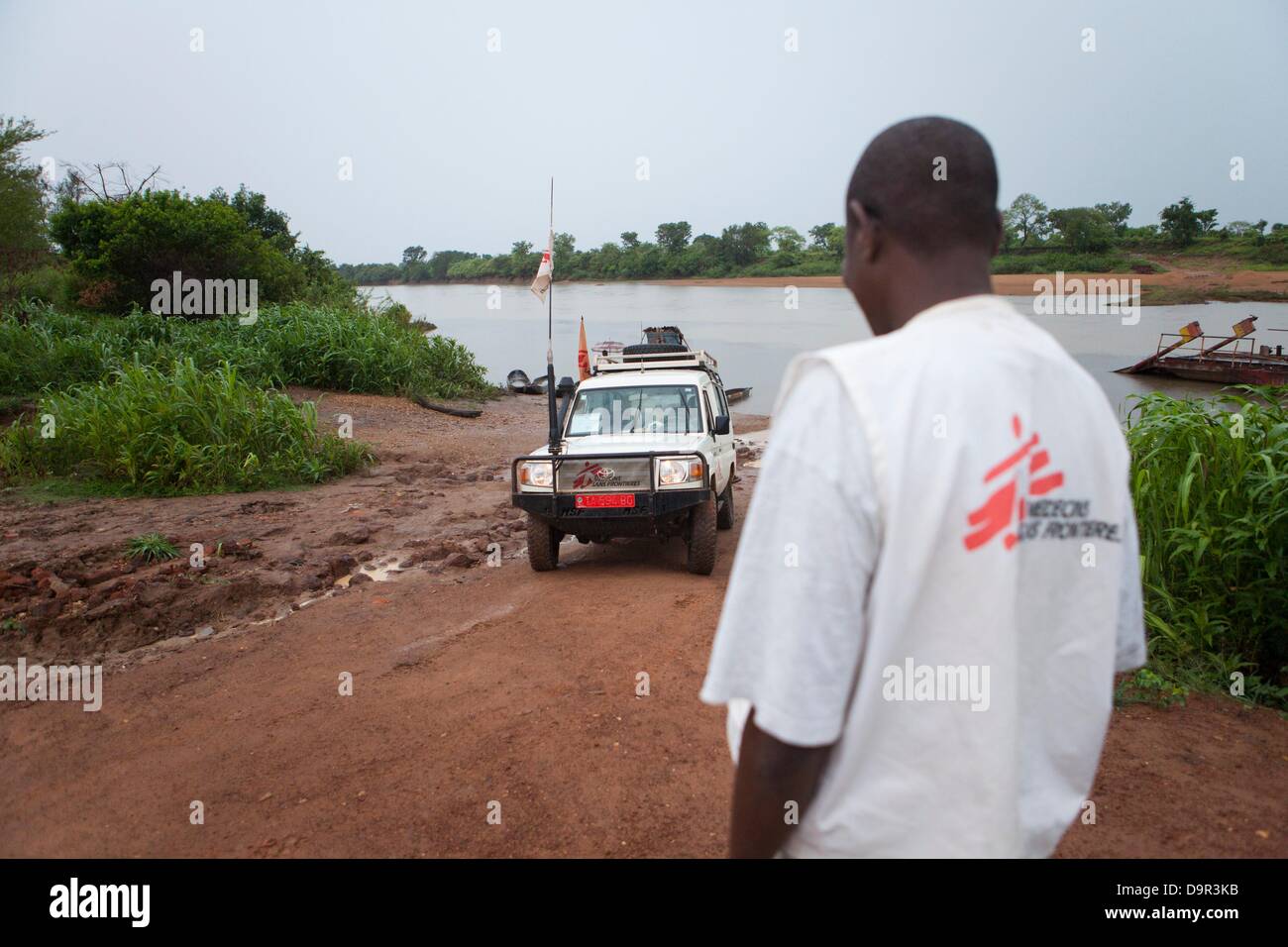 Cars of MSF crossing a river in central african republic Stock Photo ...