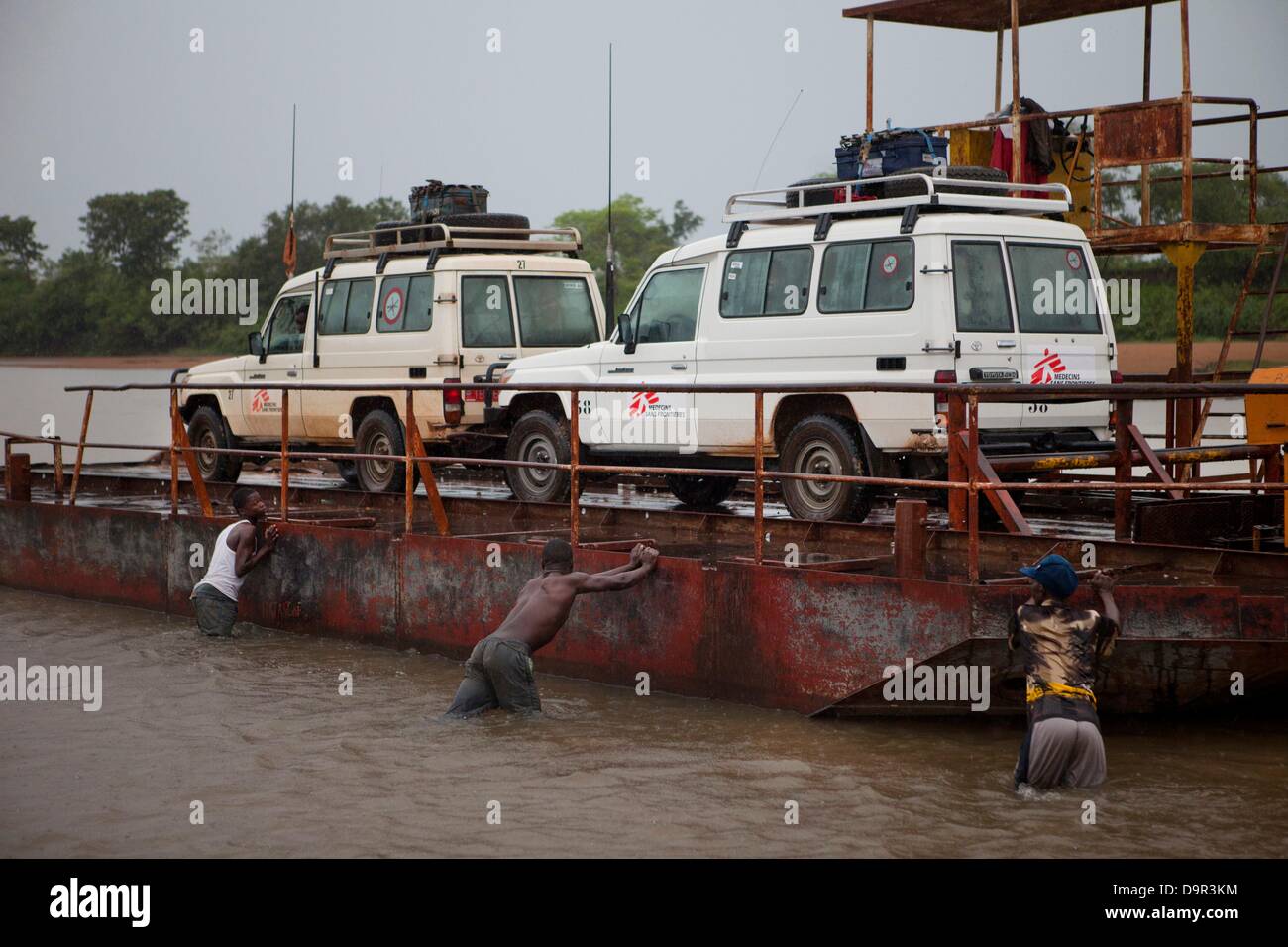 Cars of MSF crossing a river in central african republic Stock Photo ...