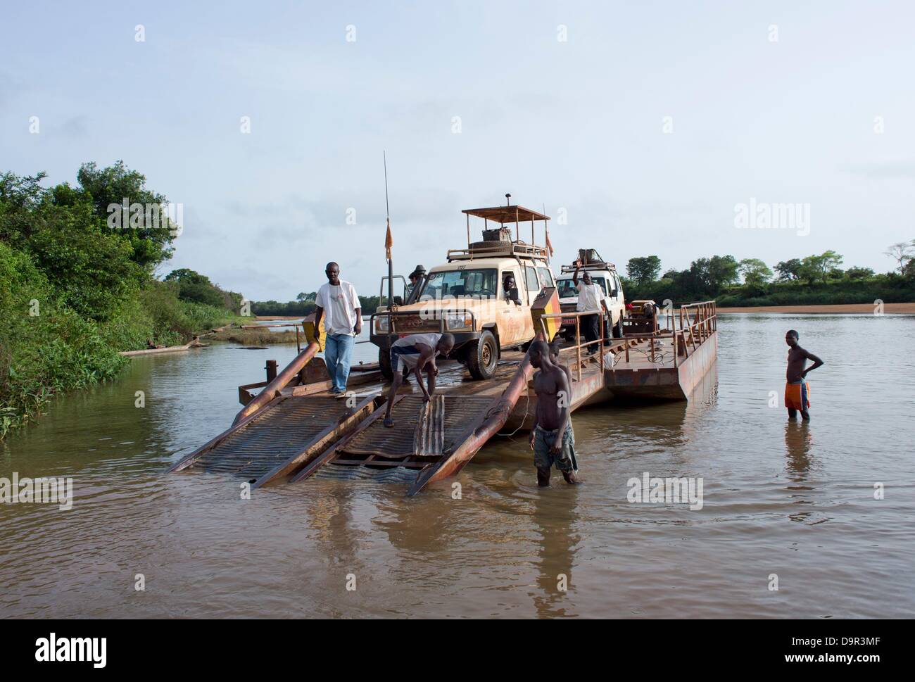 Cars of MSF crossing a river in central african republic Stock Photo ...