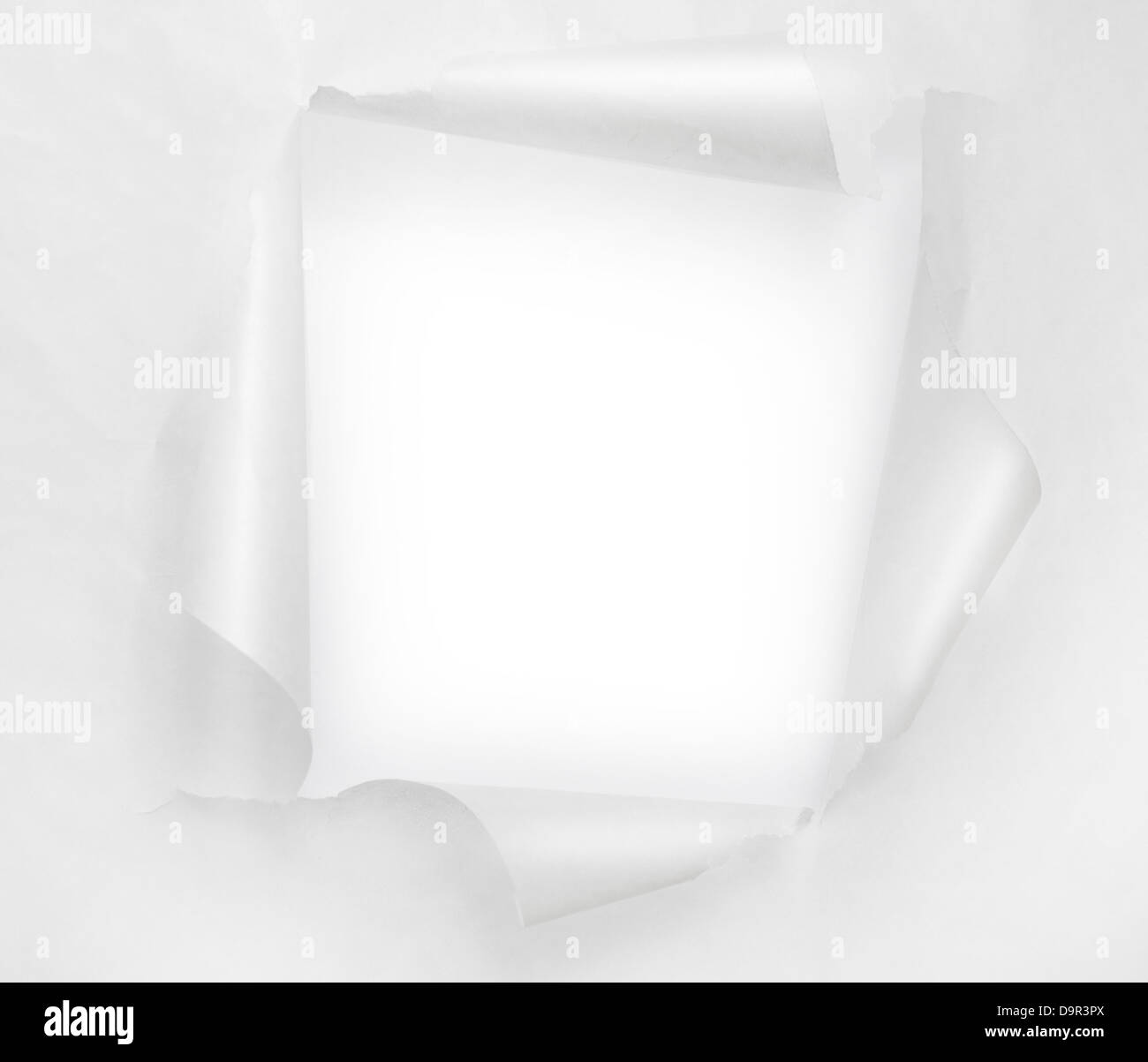 Breakthrough paper hole Stock Photo - Alamy