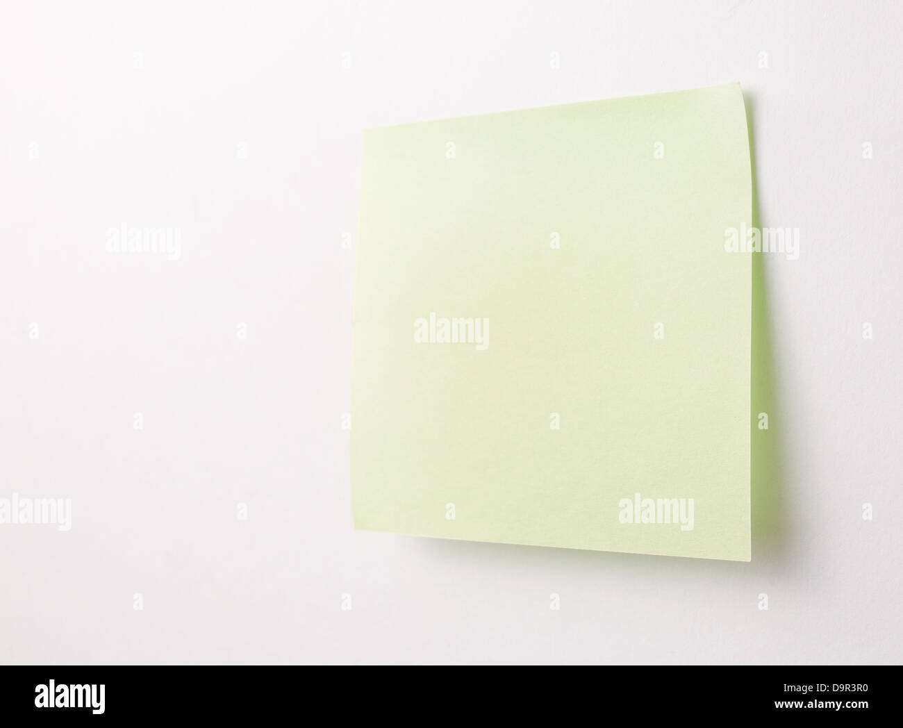 Blank Sticky Note on white wall Stock Photo - Alamy